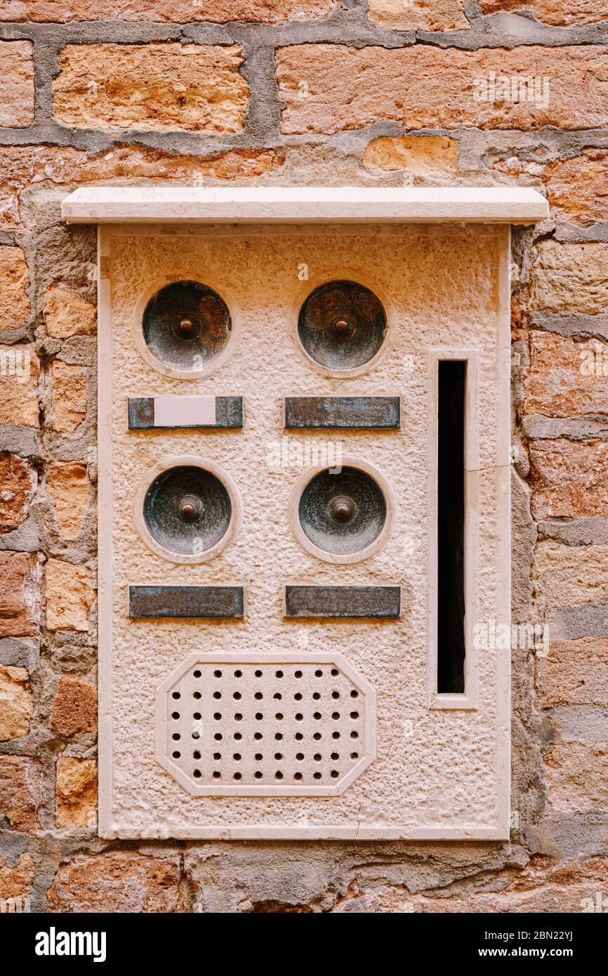 Close-ups of building facades in Venice, Italy. An old vintage intercom ...