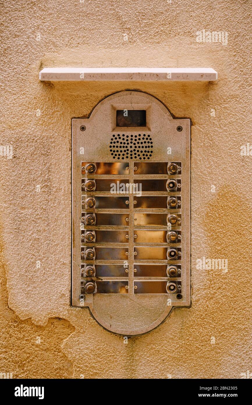 Close-ups of building facades in Venice, Italy. An old vintage intercom ...