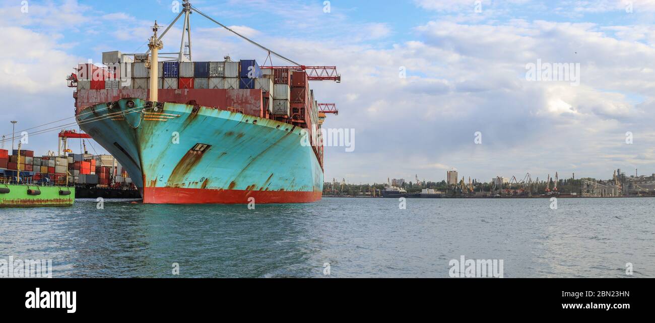 Container cargo ship load in the seaport. Logistics and transportation ...