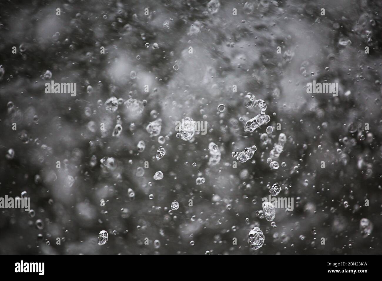 Water droplets in the air splashing Stock Photo - Alamy