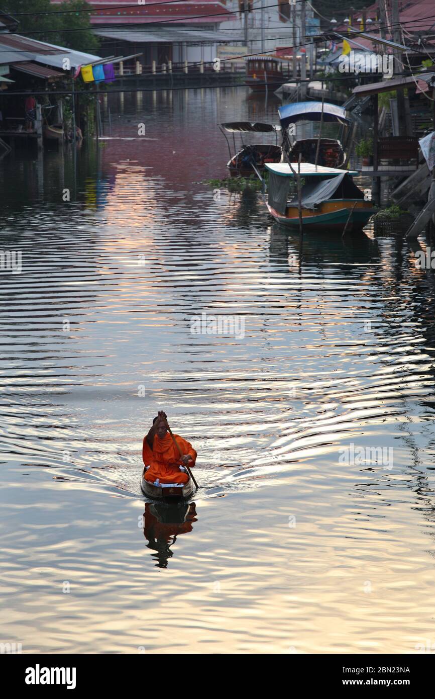 Buddhist monk on boat in hi-res stock photography and images - Alamy