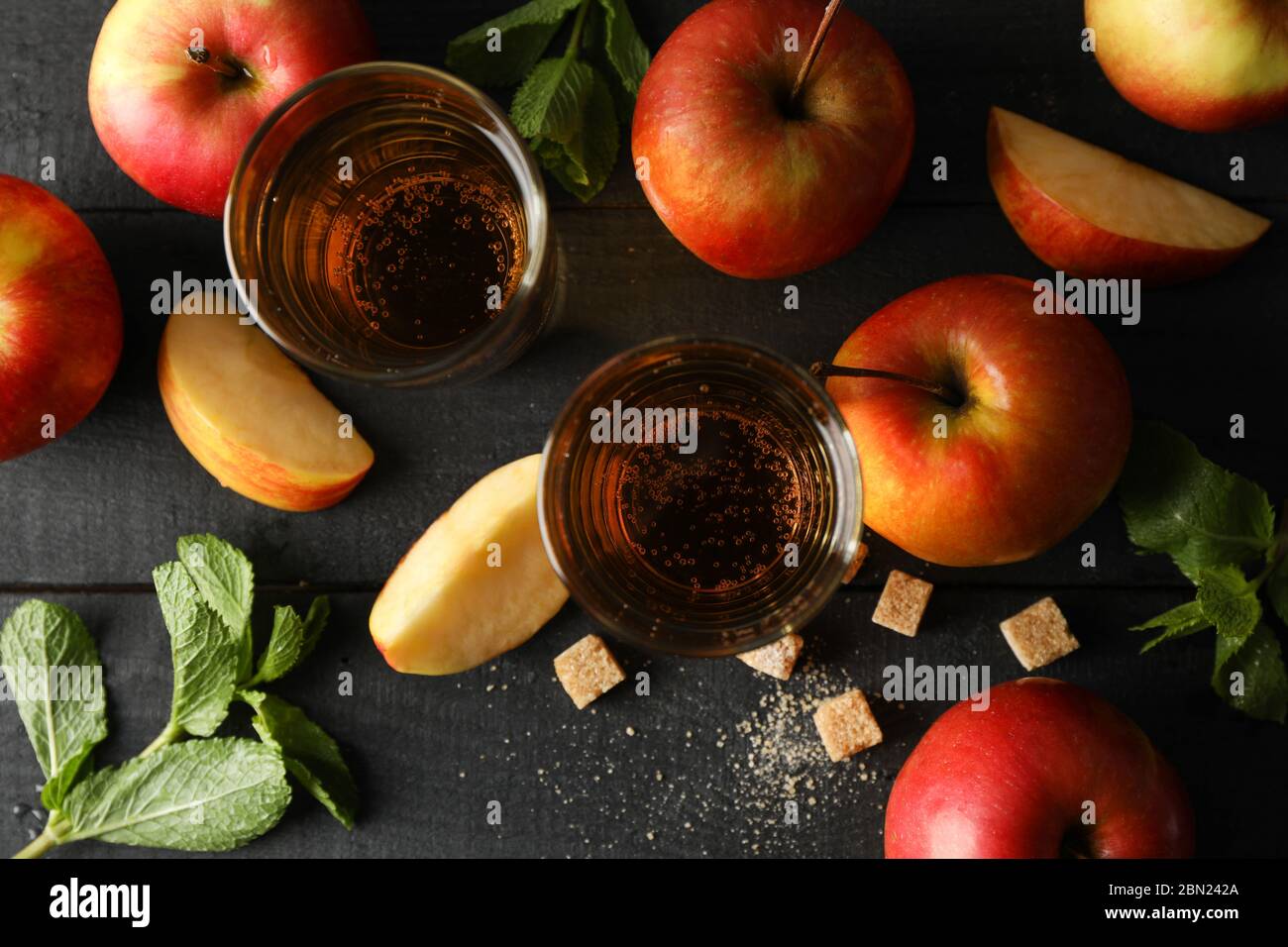 Composition with cider, sugar and apples on wooden background Stock ...