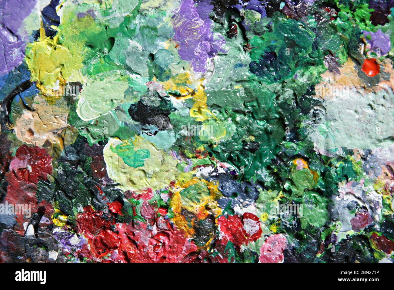 Abstract painting. Artists' palettes daubed with mixed paint. Colourful ...