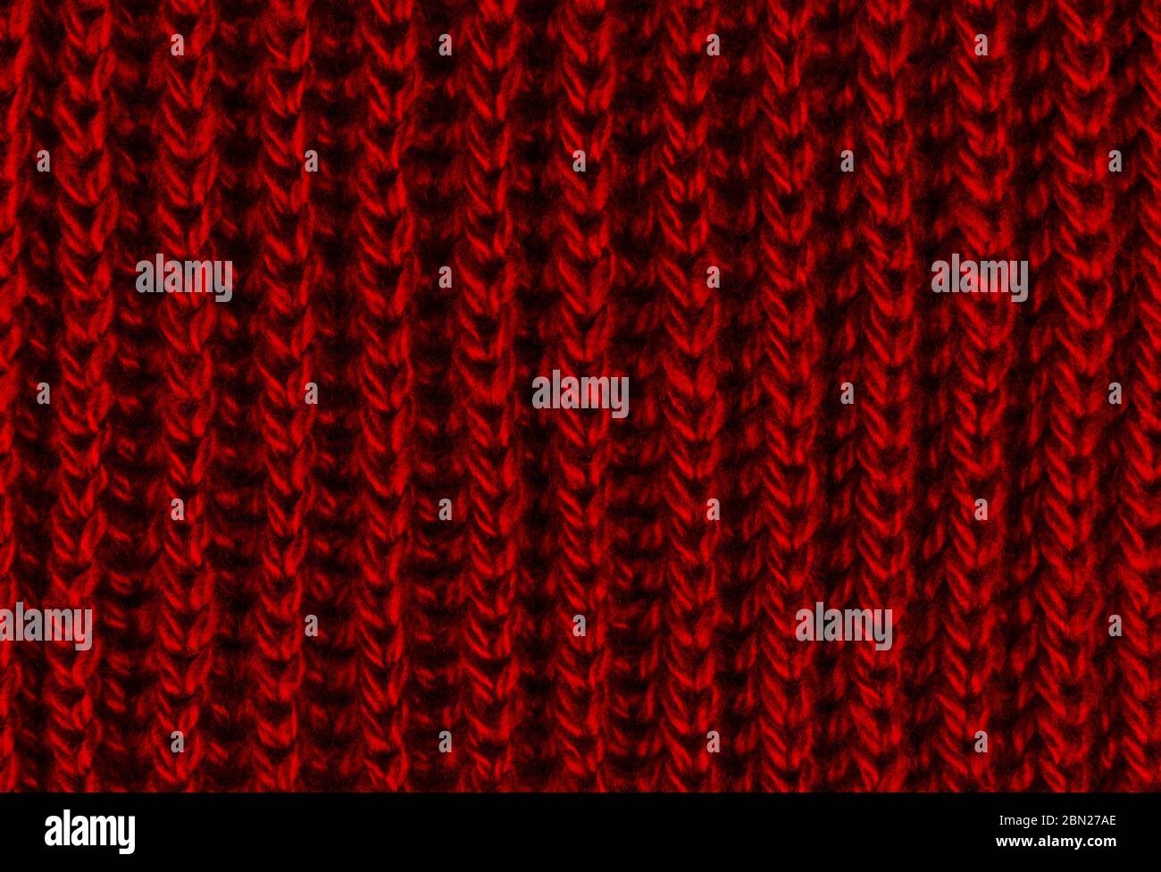 Bright red texture knitted wool scarf. Red textile background knitwear ...
