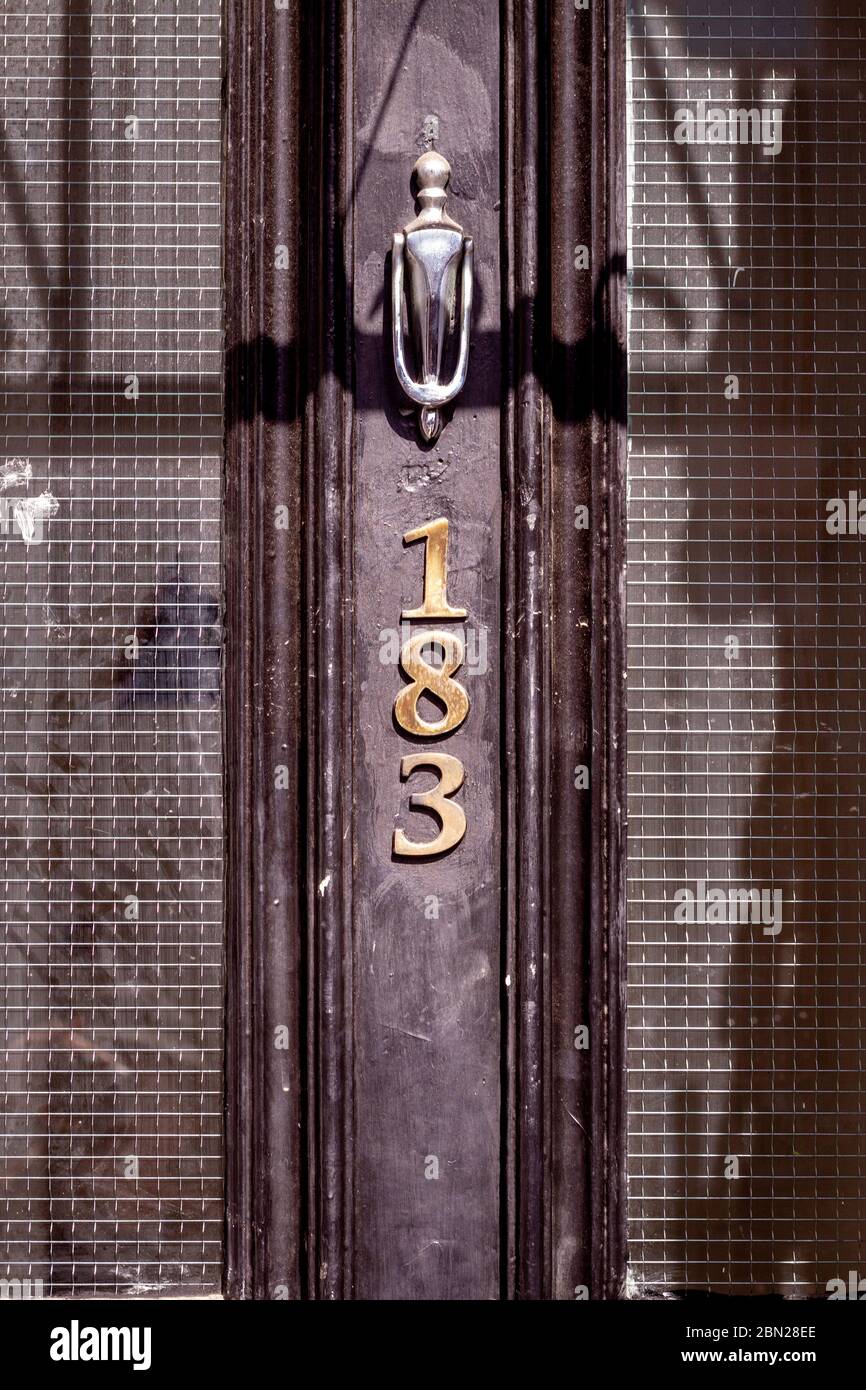 House number 183 on an old shop door in London Stock Photo - Alamy