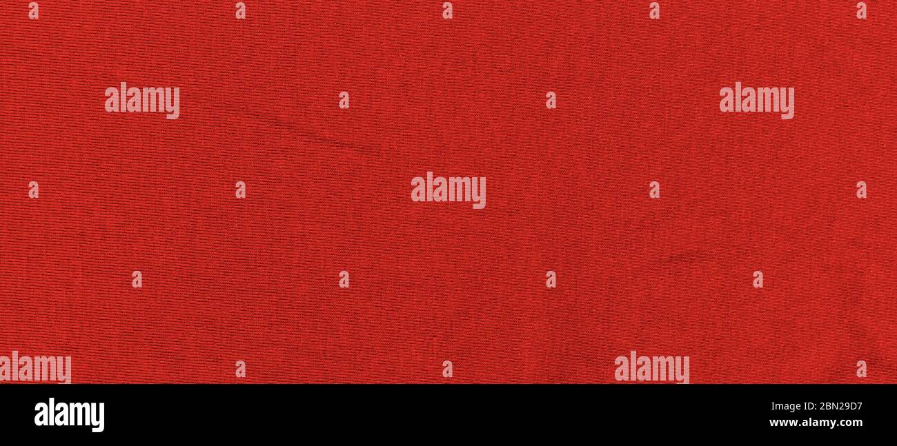 Bright red texture of knit fabric. Red textile background with natural ...