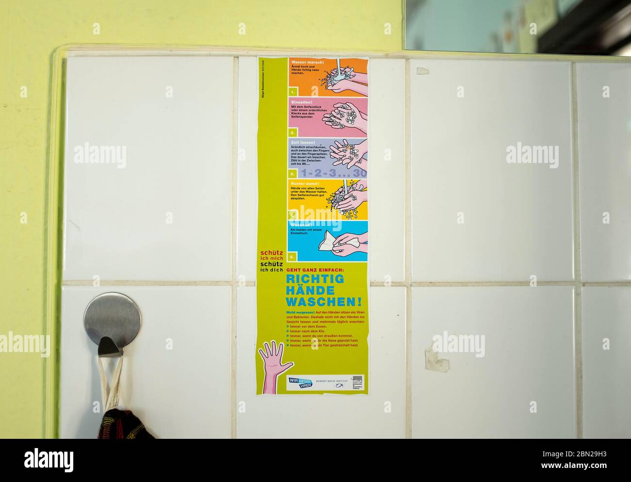 "Wash your hands properly" rules on a sink in a classroom at a primary ...