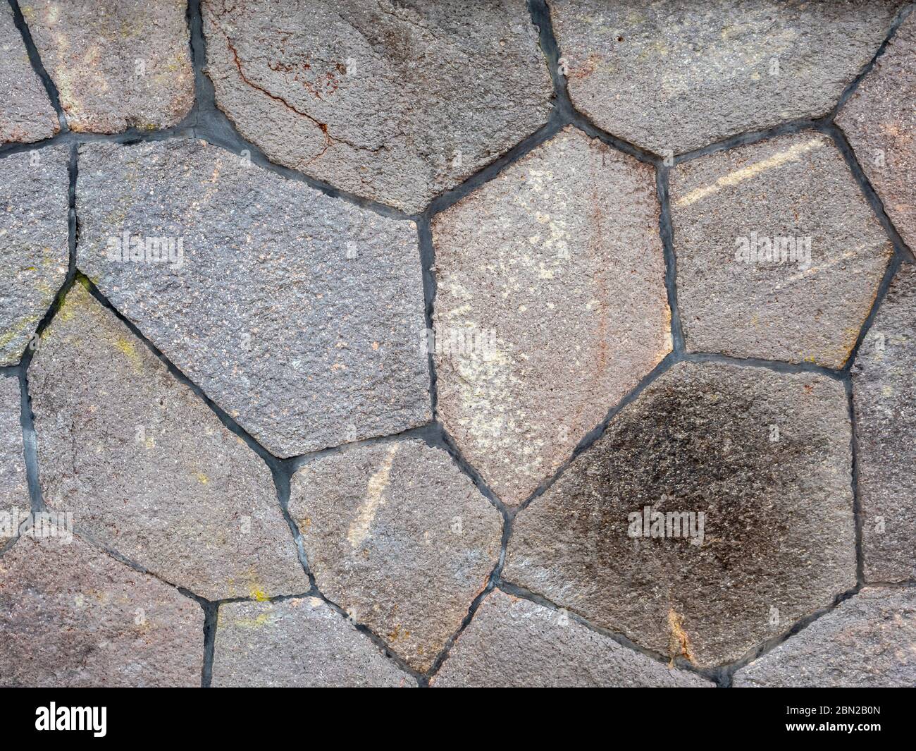 Stone wall mosaic stone background sandstone Stock Photo - Alamy