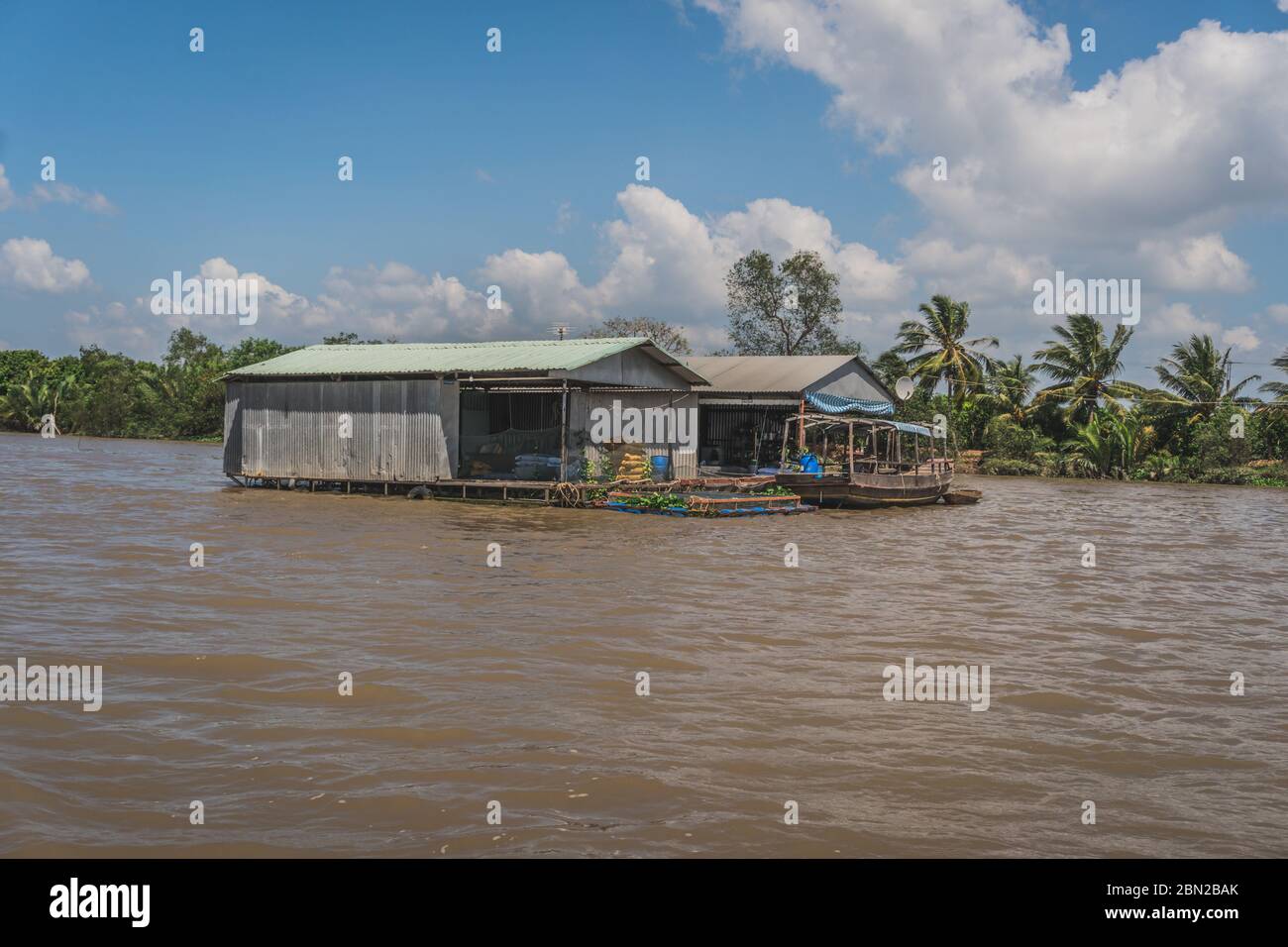 Floating house on the Mekong River in Vietnam, South East Asia. Vung ...