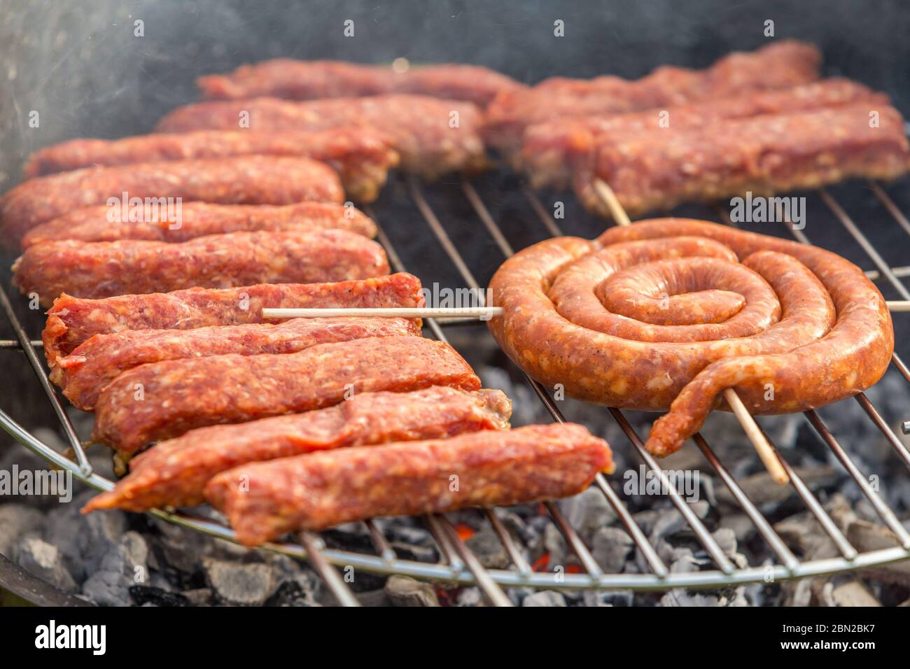 Sausages and traditional romanian sausages called ”mici” or ”mititei ...
