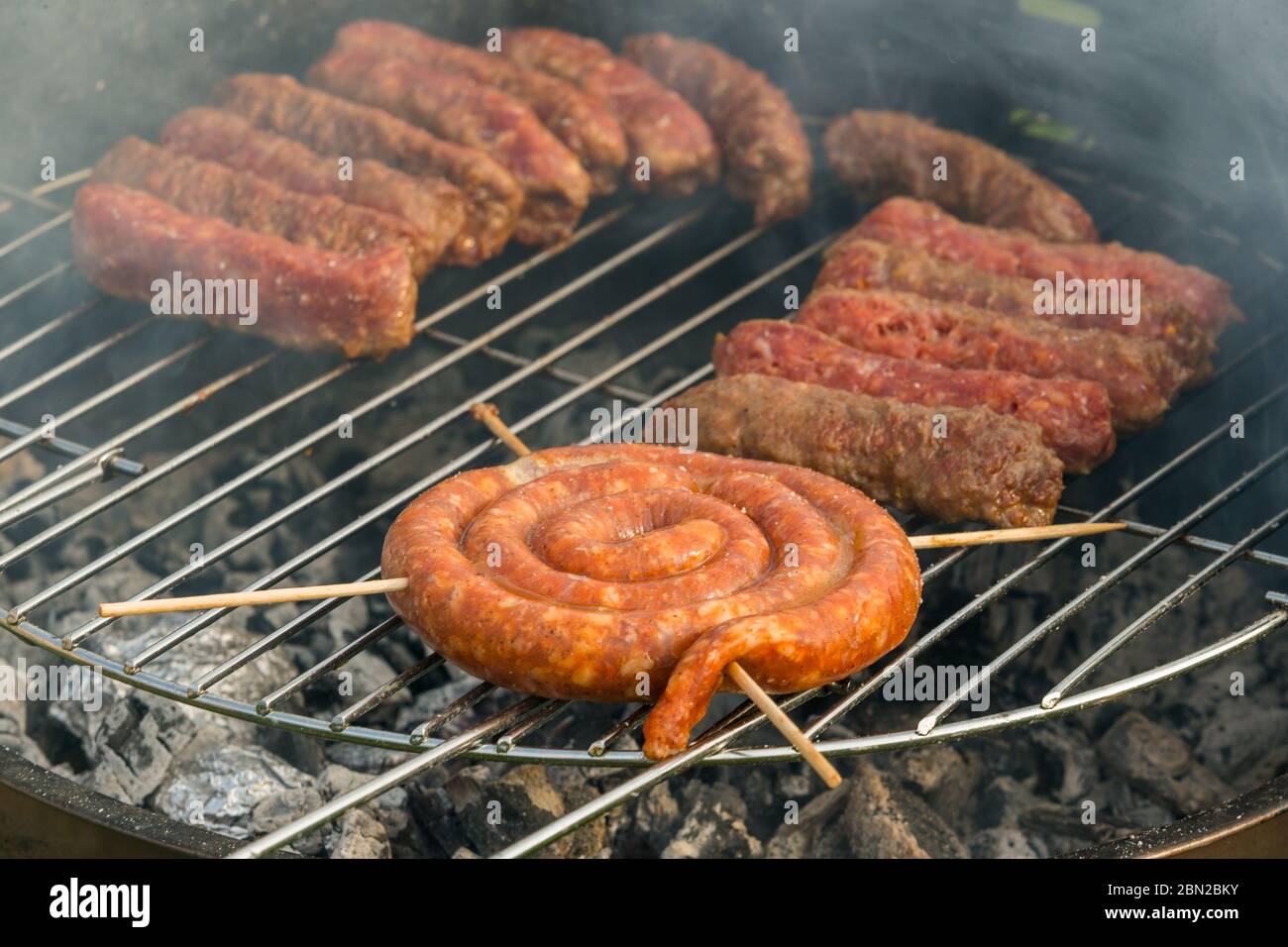 Sausages and traditional romanian sausages called ”mici” or ”mititei ...