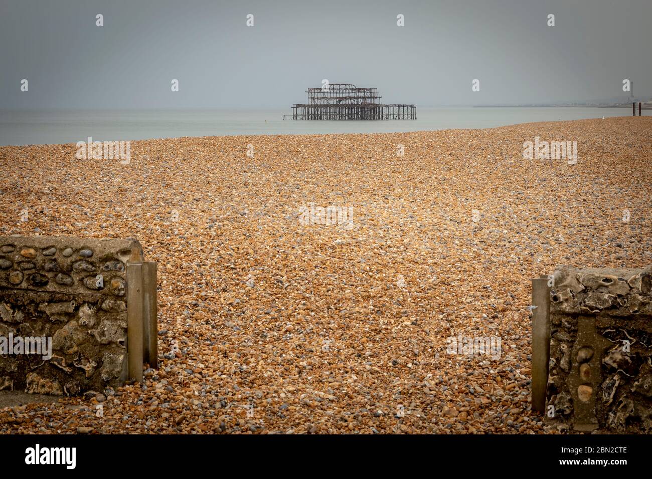 Brighton west pier and pebble overflow Stock Photo - Alamy