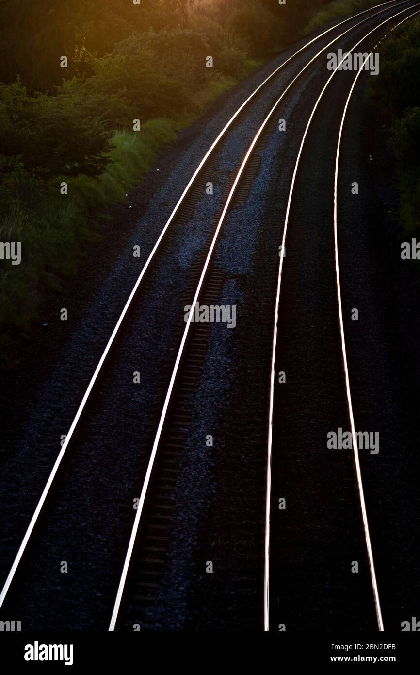 train tracks lit up in the sun Stock Photo - Alamy