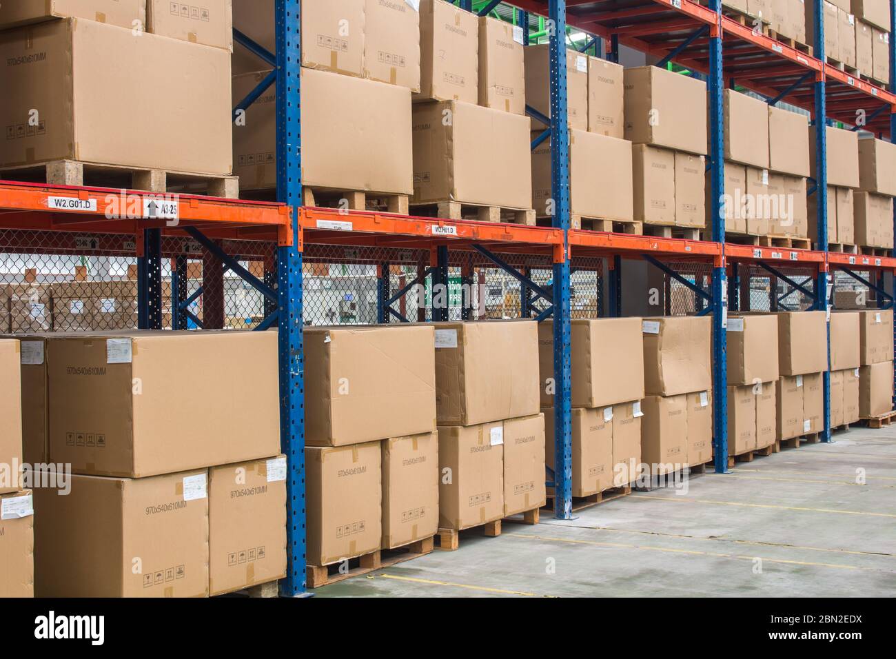 interior of warehouse. Rows of shelves with boxes Stock Photo - Alamy