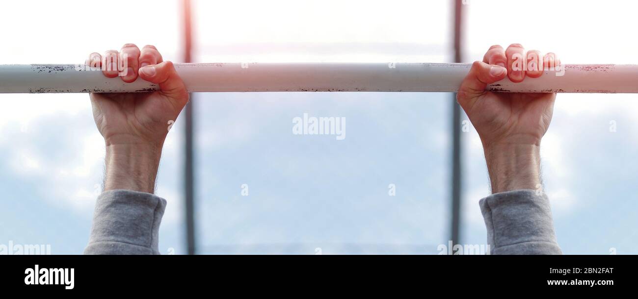 Strong man holding hi-res stock photography and images - Alamy