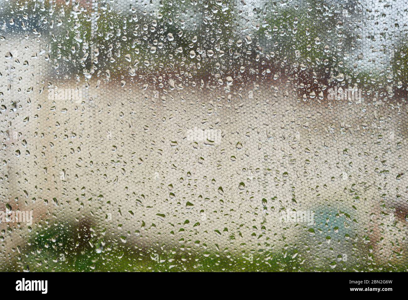 Rainy day with rain drops on a window macro shoot Stock Photo - Alamy