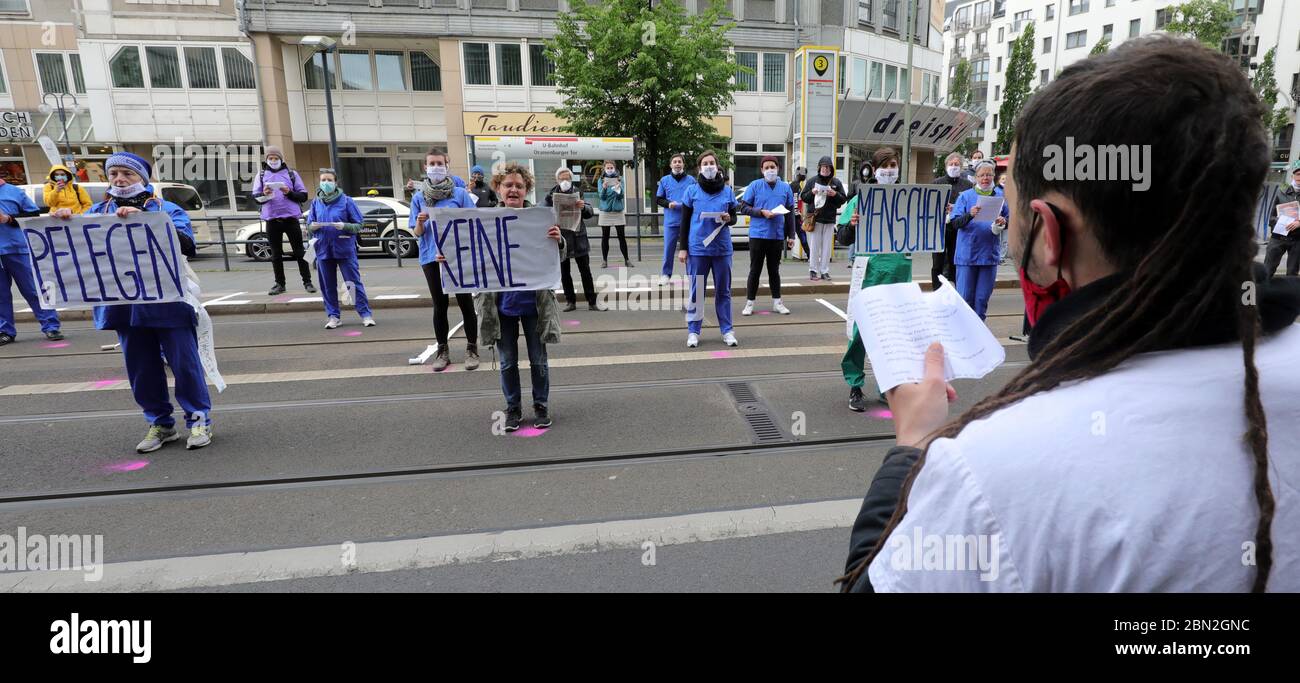 Berlin, Germany. 12th May, 2020. People wearing face masks take part in ...