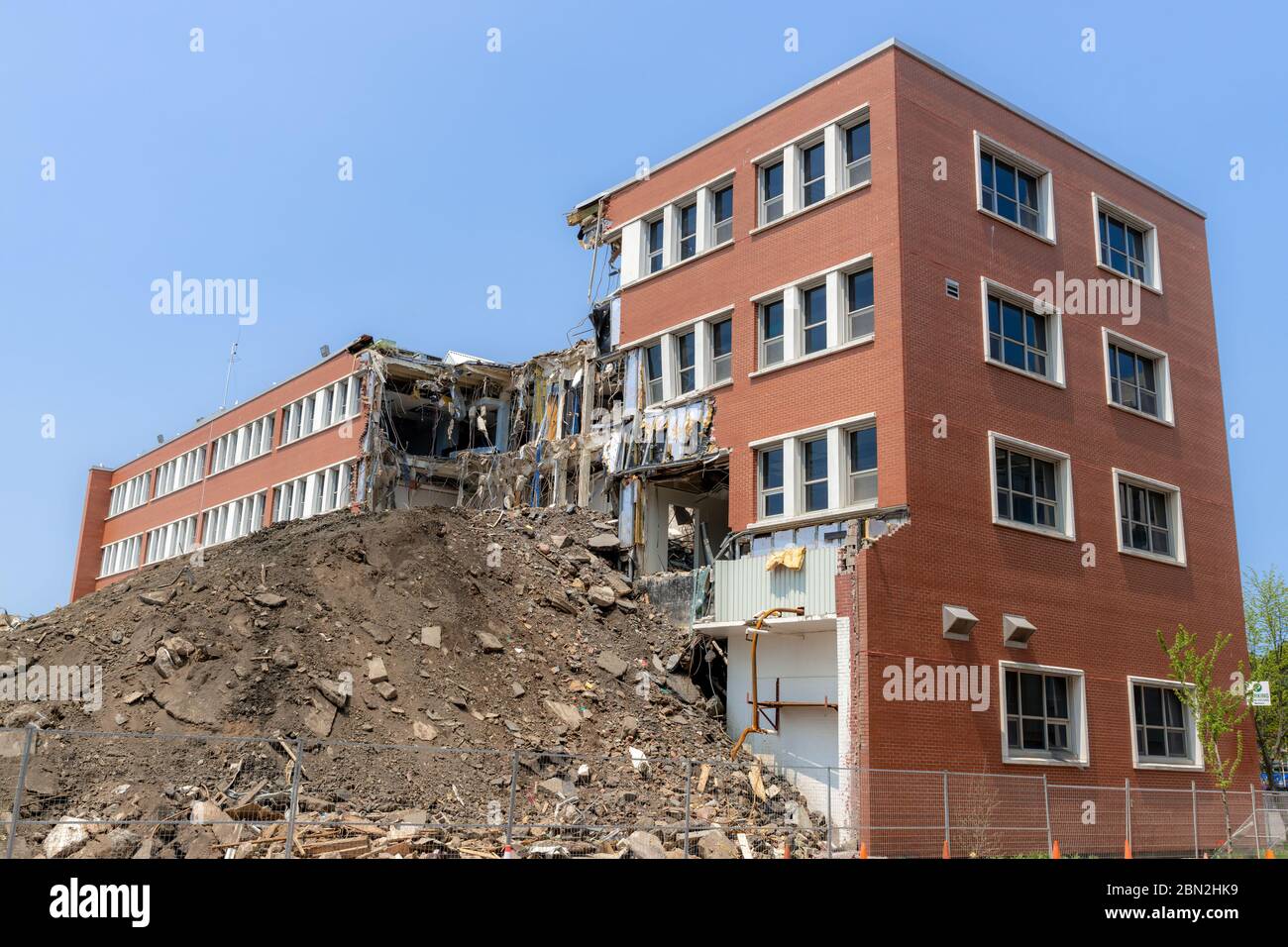 A partially demolished building. Much of the center of the building is ...