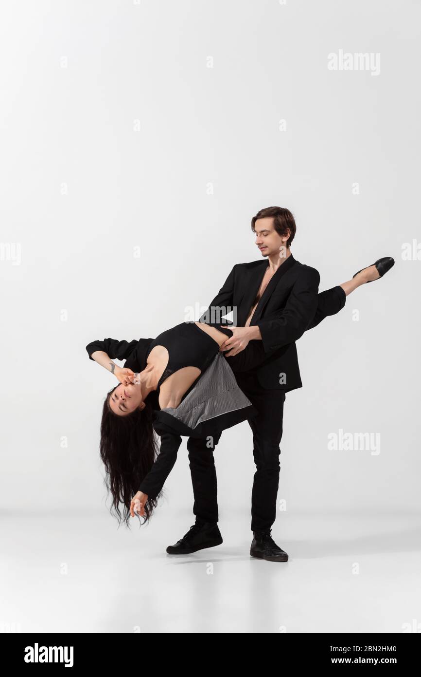 Young and graceful ballet dancers in minimal black style isolated on ...