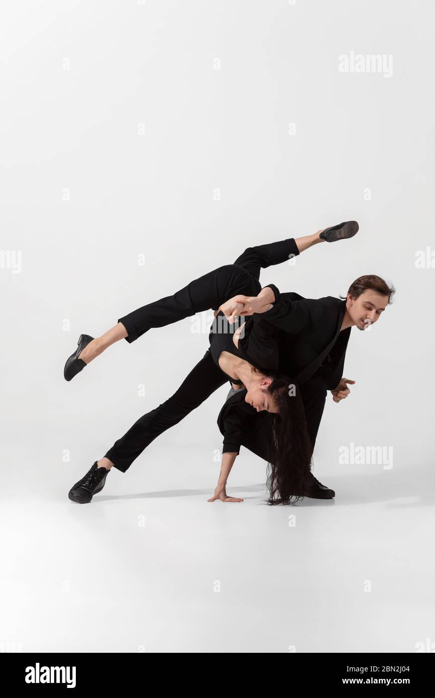 Young and graceful ballet dancers in minimal black style isolated on ...
