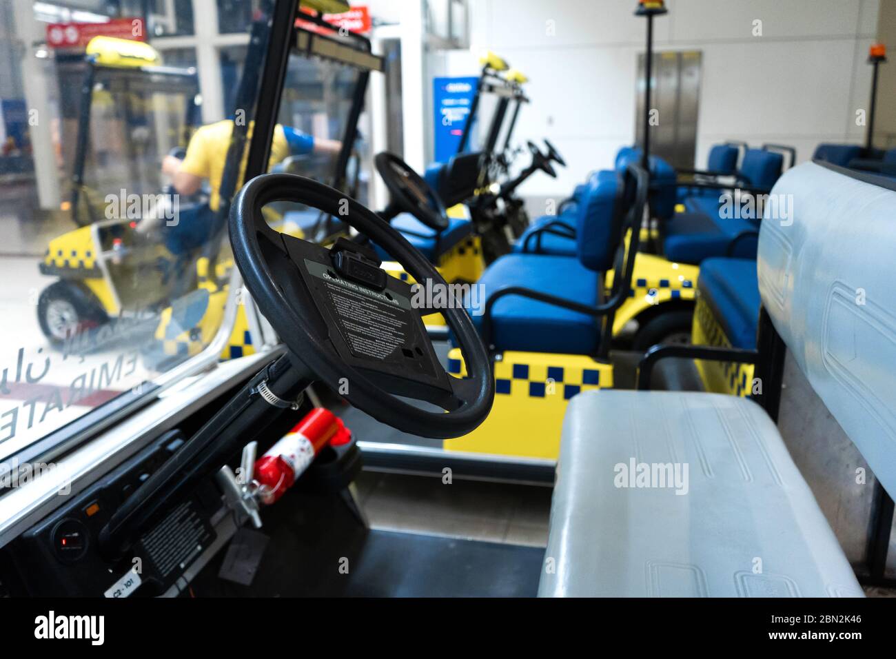 Electric car fleet taxi in the airport terminal. Taxi for transporting ...
