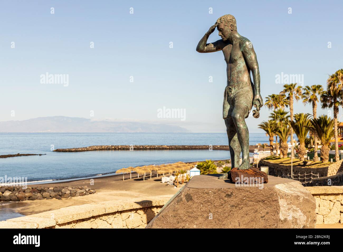 Statue of Javier Perez Ramos at the viewpoint overlooking Playa del Duque beach, Costa Adeje ...