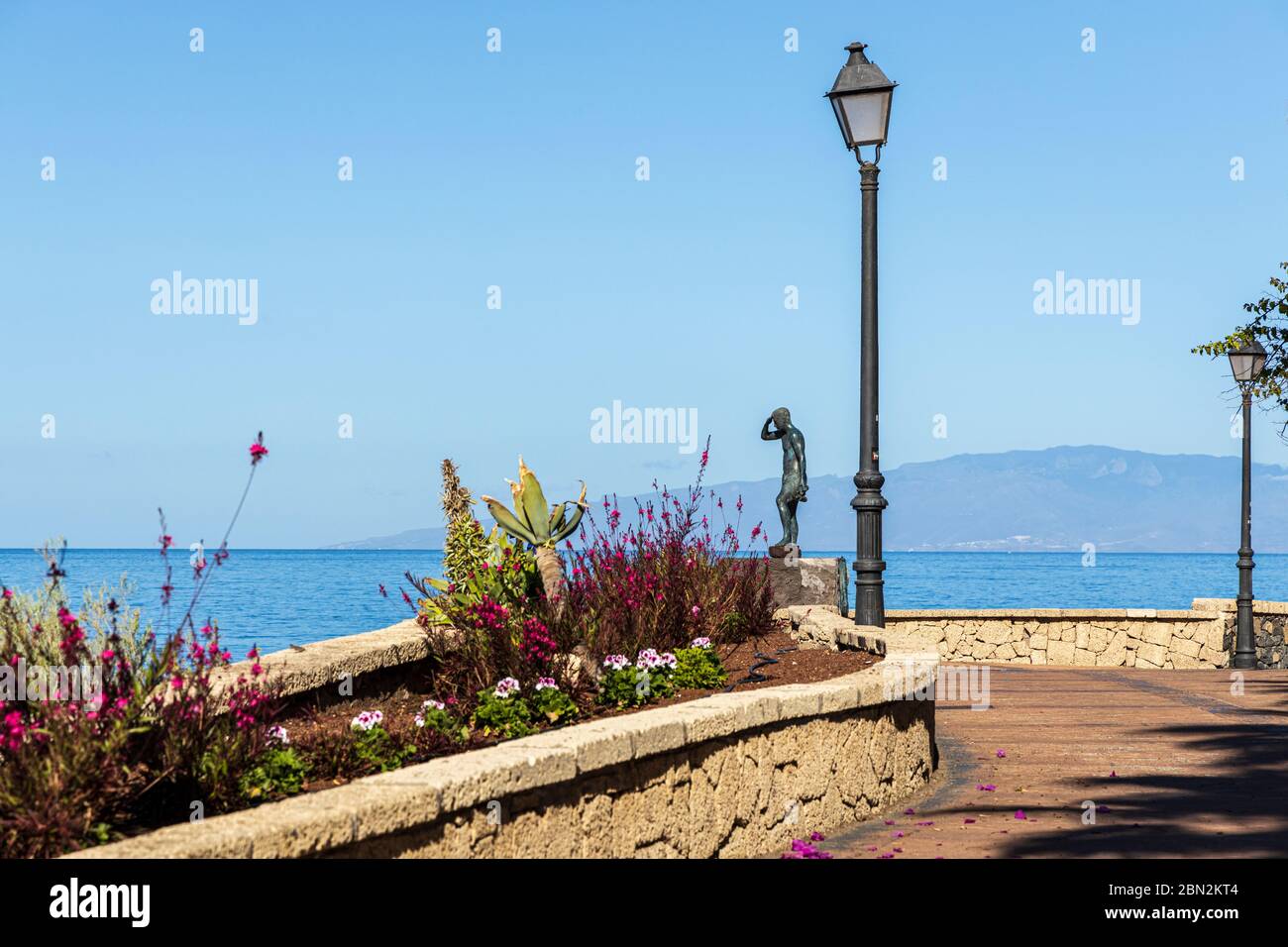 Statue of Javier Perez Ramos at the viewpoint overlooking Playa del Duque beach, Costa Adeje ...