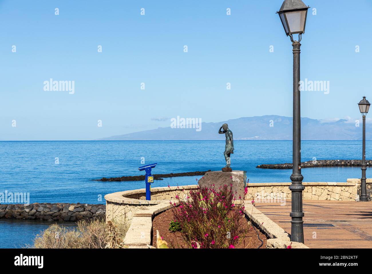 Statue of Javier Perez Ramos at the viewpoint overlooking Playa del Duque beach, Costa Adeje ...