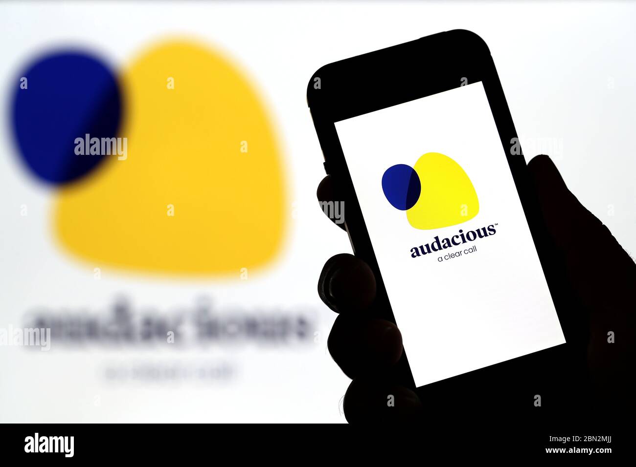 Audacious mobile phone network logo on a mobile phone (Editorial use ...