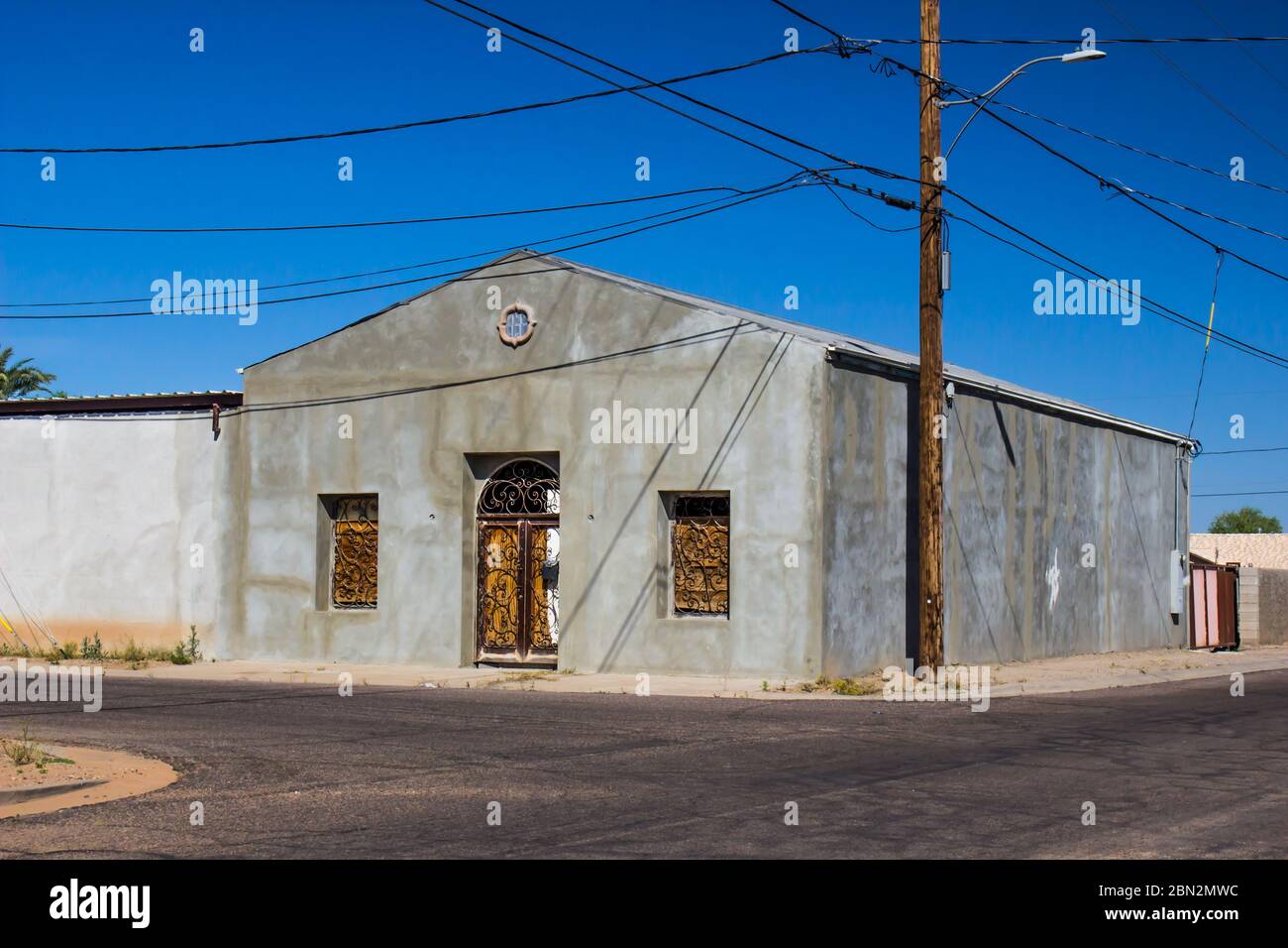 Old Abandoned Corner Building With Ornate Wrought Iron Windows Stock ...