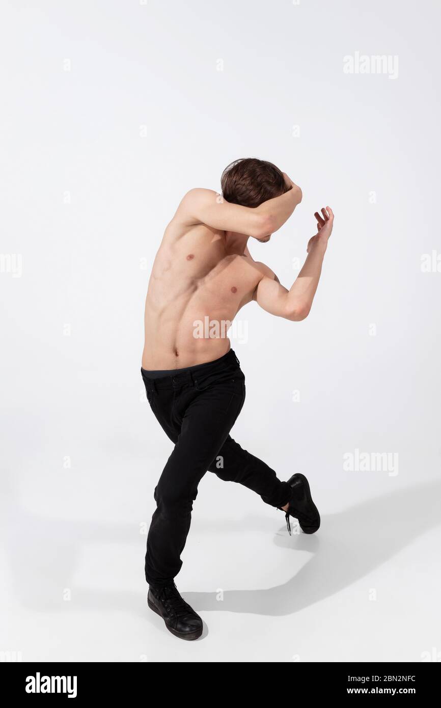 Young and graceful ballet dancer in minimal black style isolated on ...