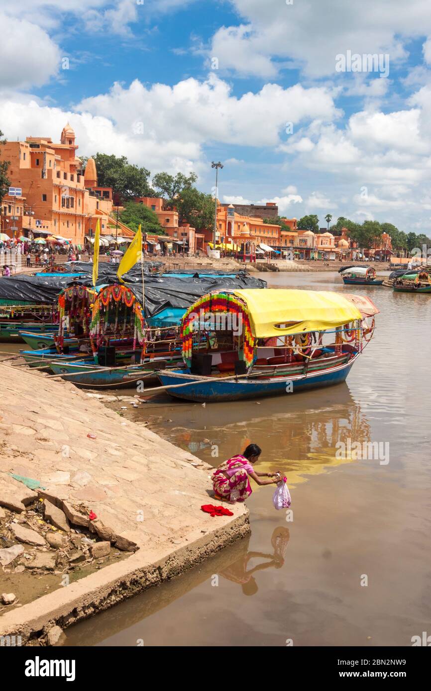 Chitrakoot, Madhya Pradesh, India : A woman does laundry by the ...