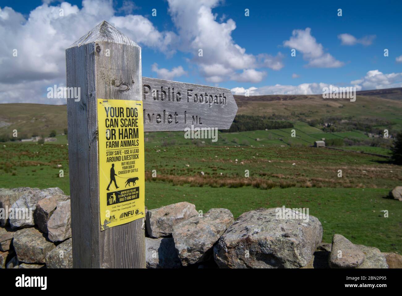 Sign on a Public Footpath signpost, warning against allowing dogs of ...