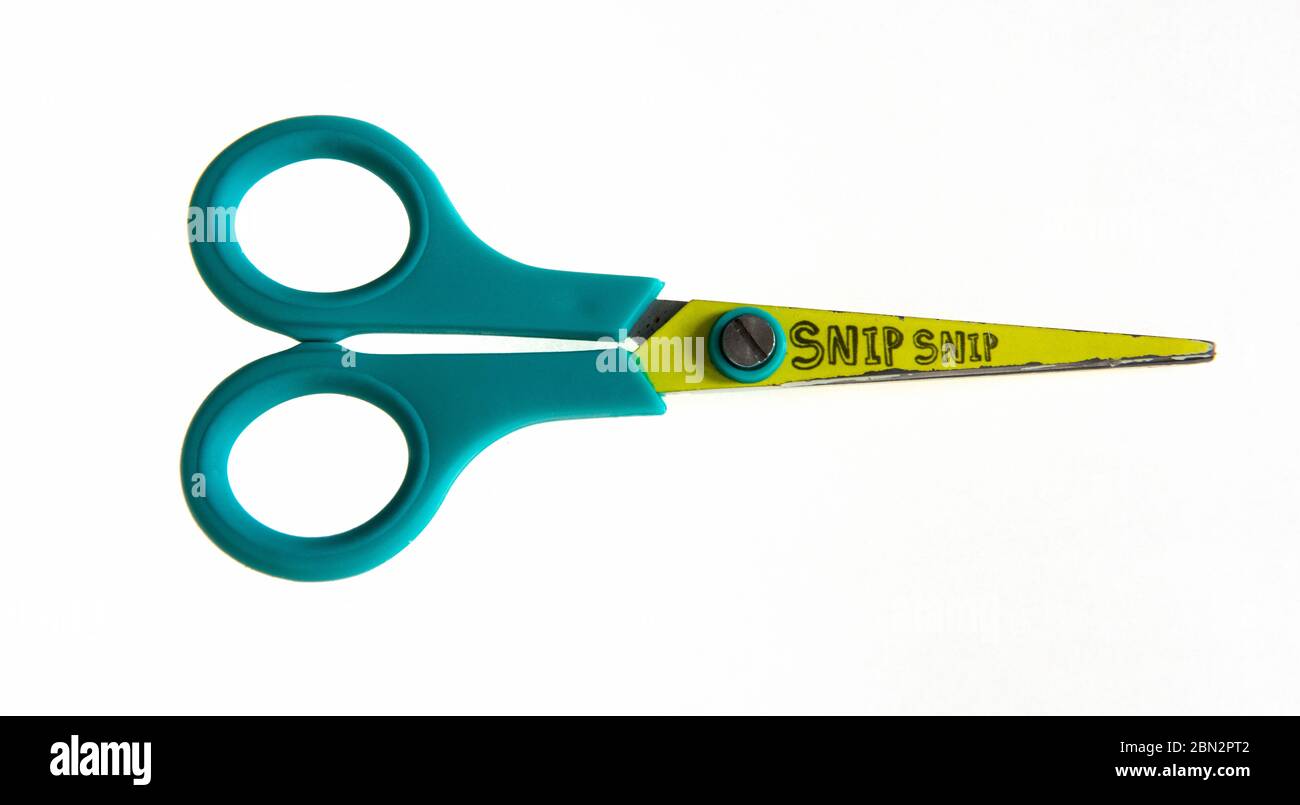 Small pair of cutting scissors on a white background Stock Photo - Alamy