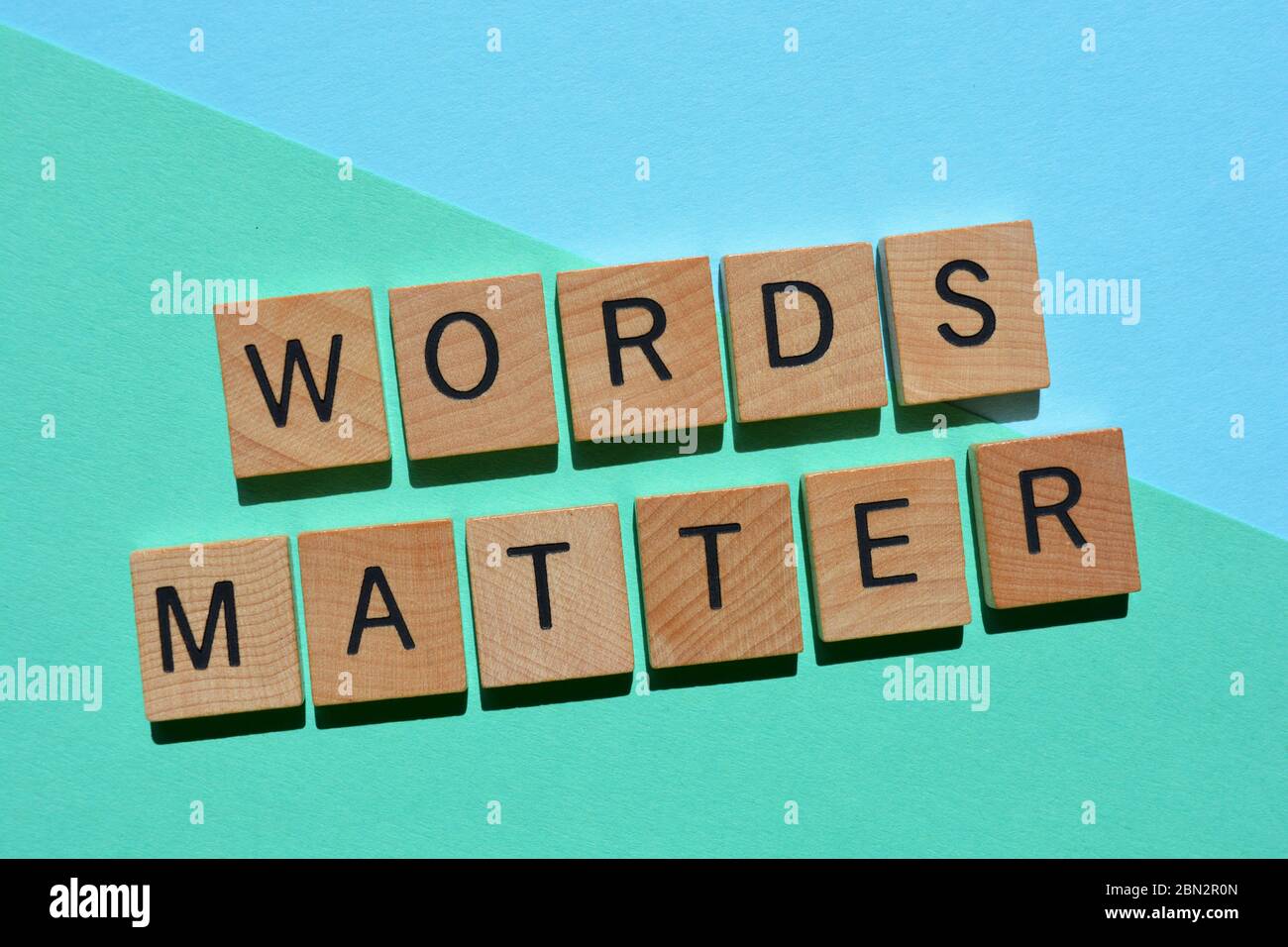 Words Matter, phrase in wooden alphabet letters on turquoise Stock ...
