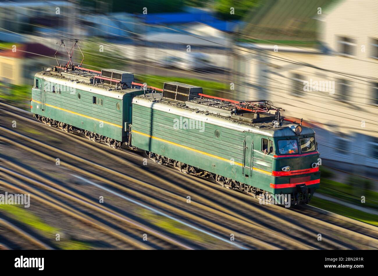 Locomotive electric locomotive on the railway at speed Stock Photo - Alamy