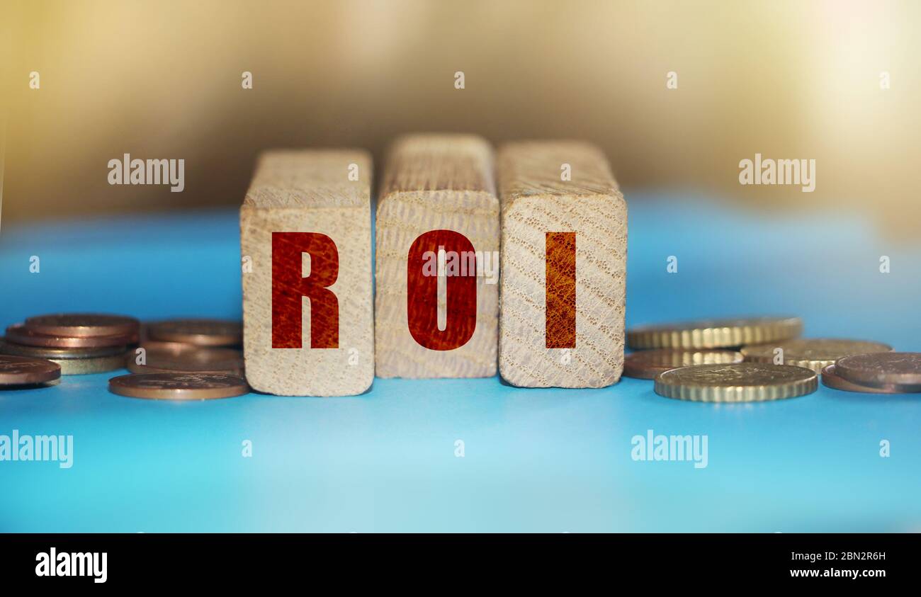 ROI on Wooden blocks and coins. Return on Equity. Business ...