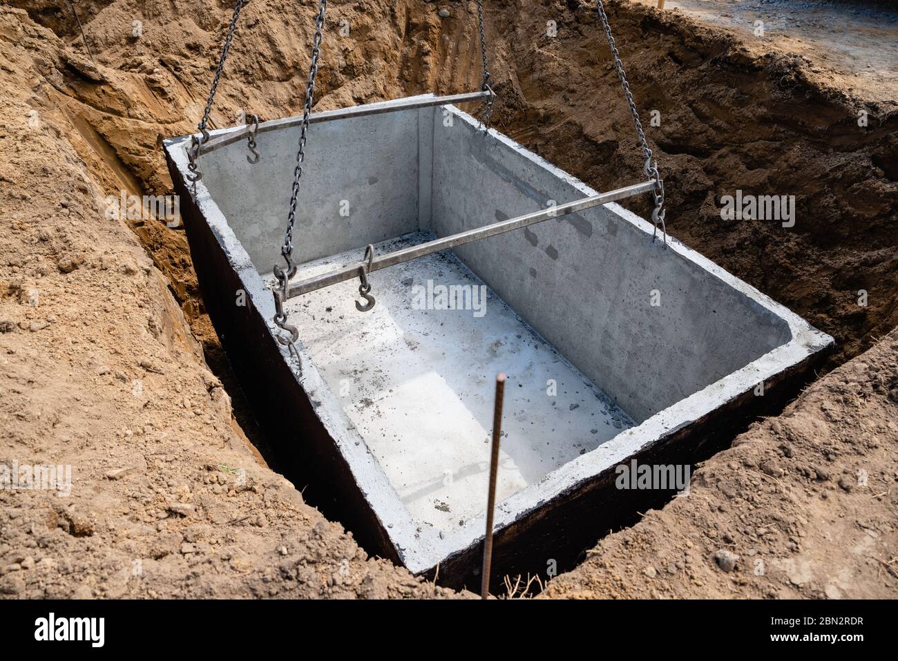 concrete rainwater tank embedded underground Stock Photo - Alamy