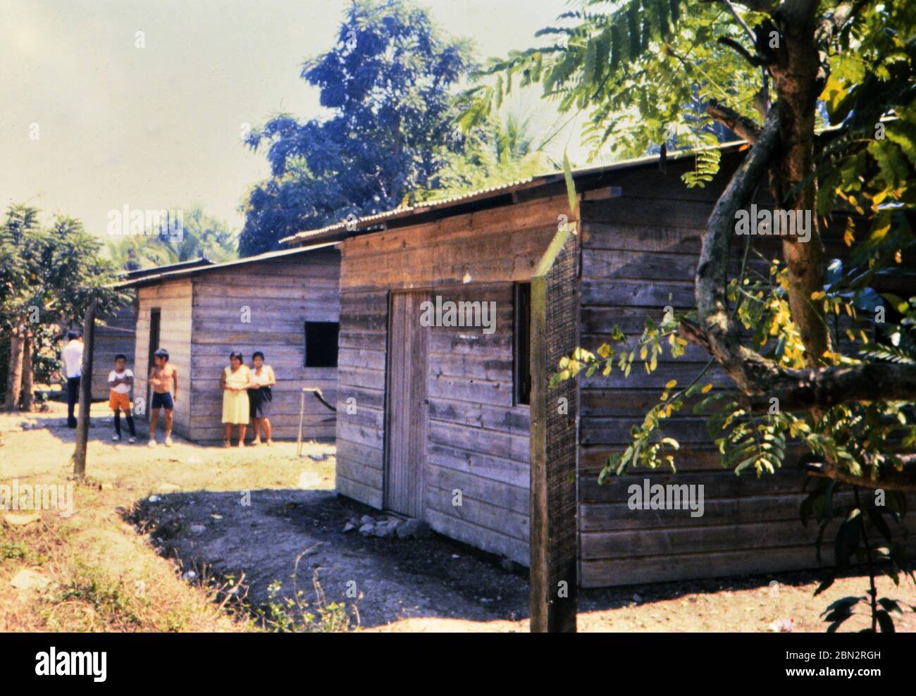 Latin America / Honduras ca. 1987 - People outside their homes in a ...