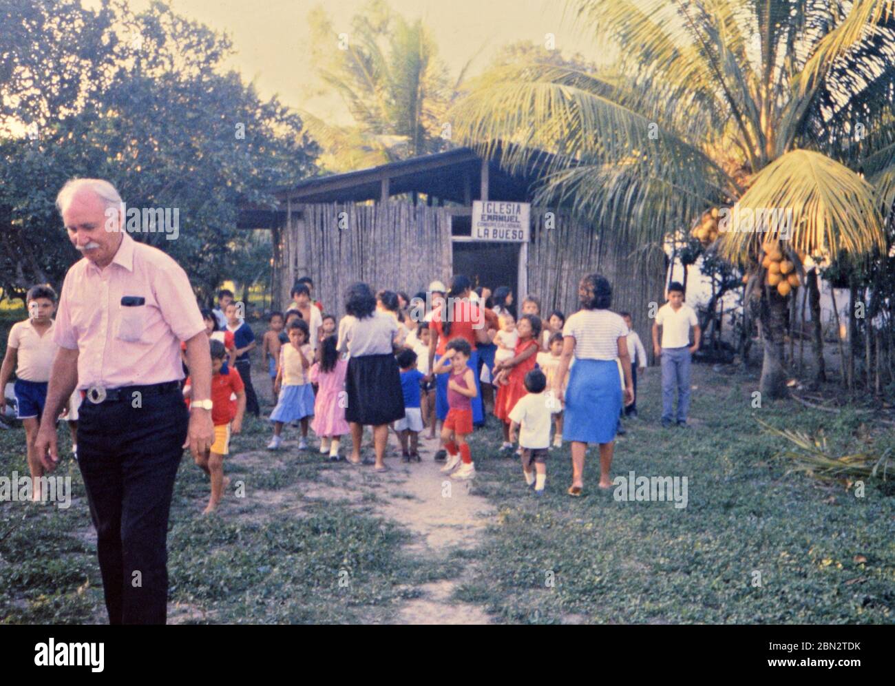 Latin America / Honduras ca. 1987 - Adults and children outside a ...