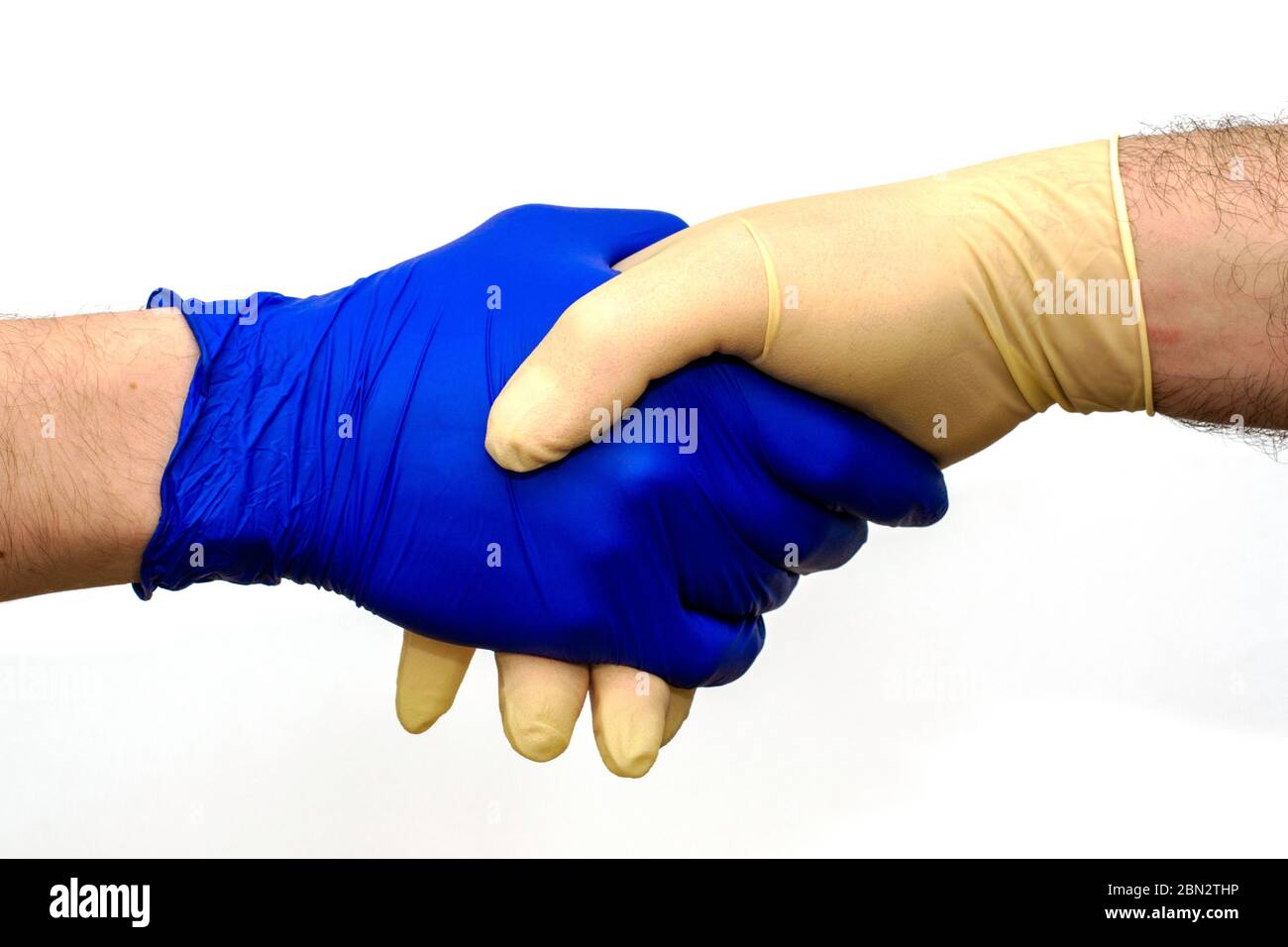 handshake of two hands in protective hygienic surgical gloves of ...
