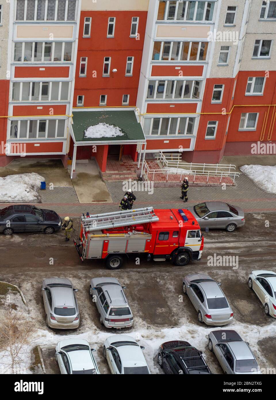 Fire engine in the courtyard of a multi-storey residential building in ...