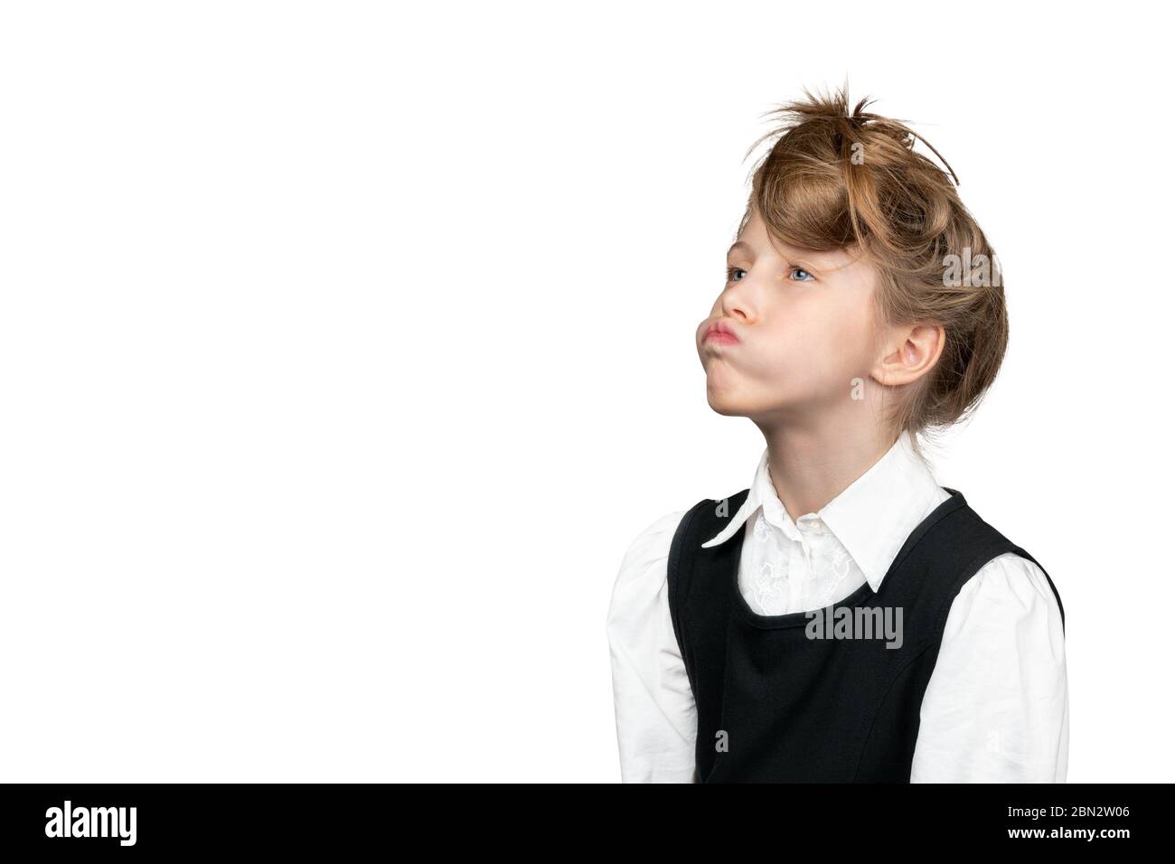 Portrait of a girl in a school uniform with pouting cheeks and shaggy ...