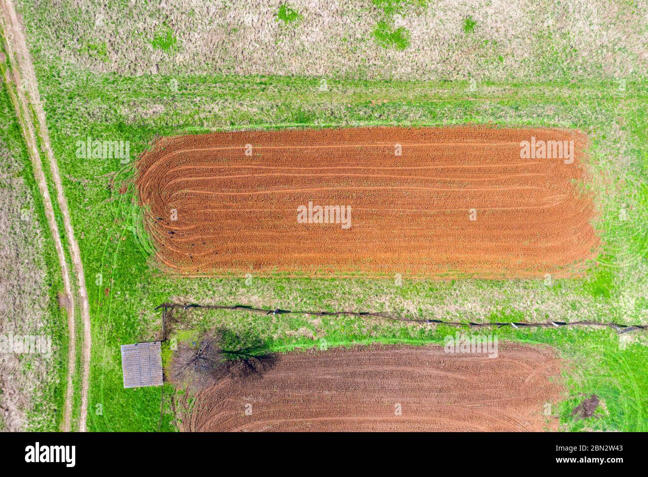 Small empty field in the village before planting vegetables, fence and ...