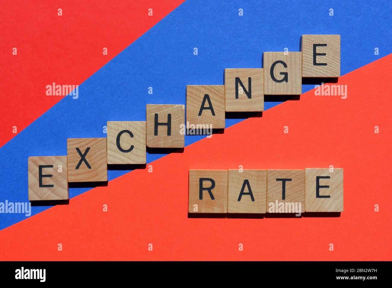 Exchange Rate, words in wooden alphabet letters on red and blue ...