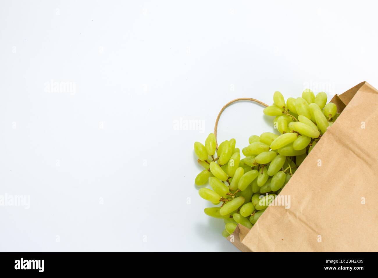Grapes paper bag of craft paper on white background. Free space for ...