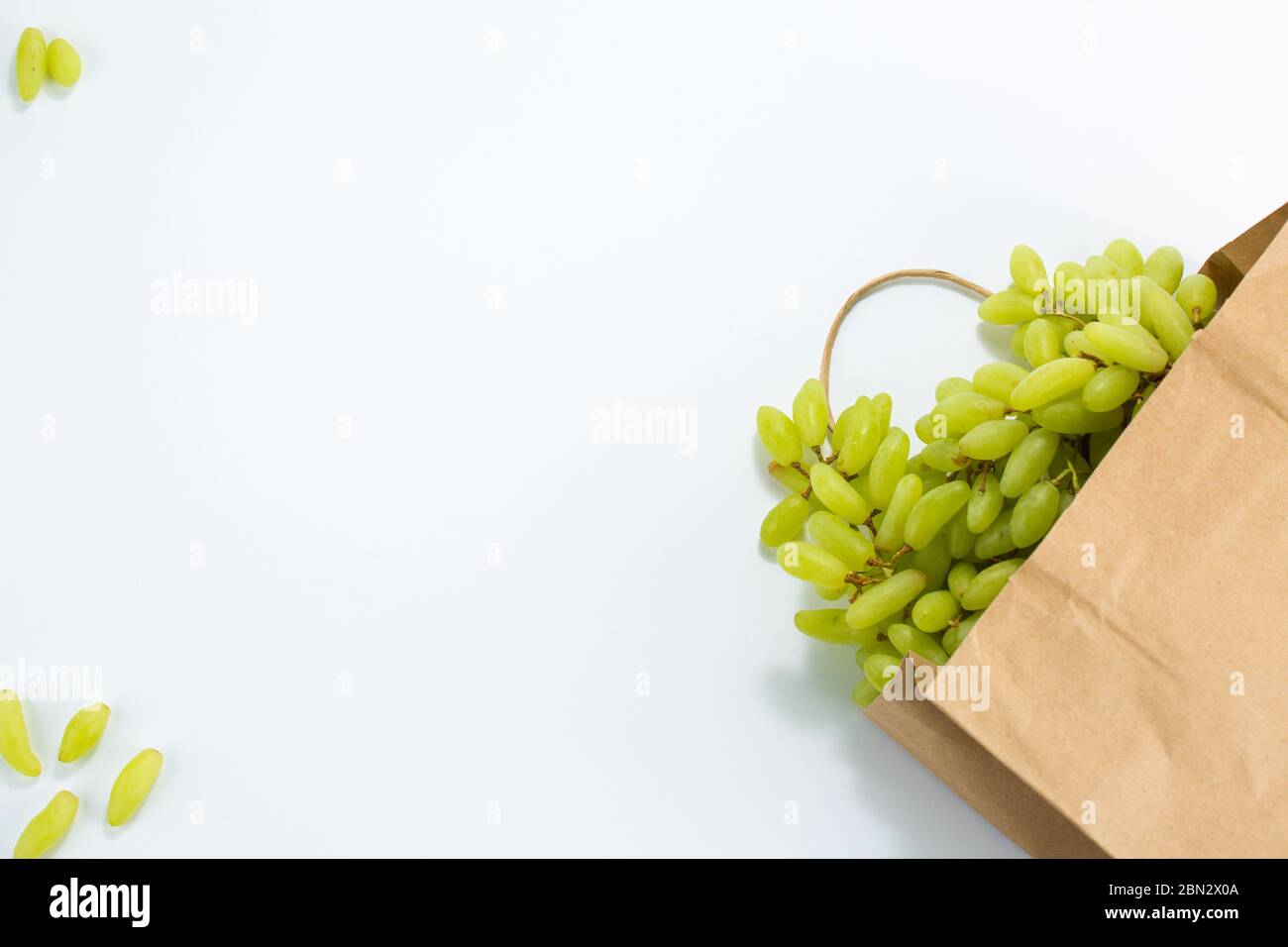 Grapes paper bag of craft paper on white background. Free space for ...