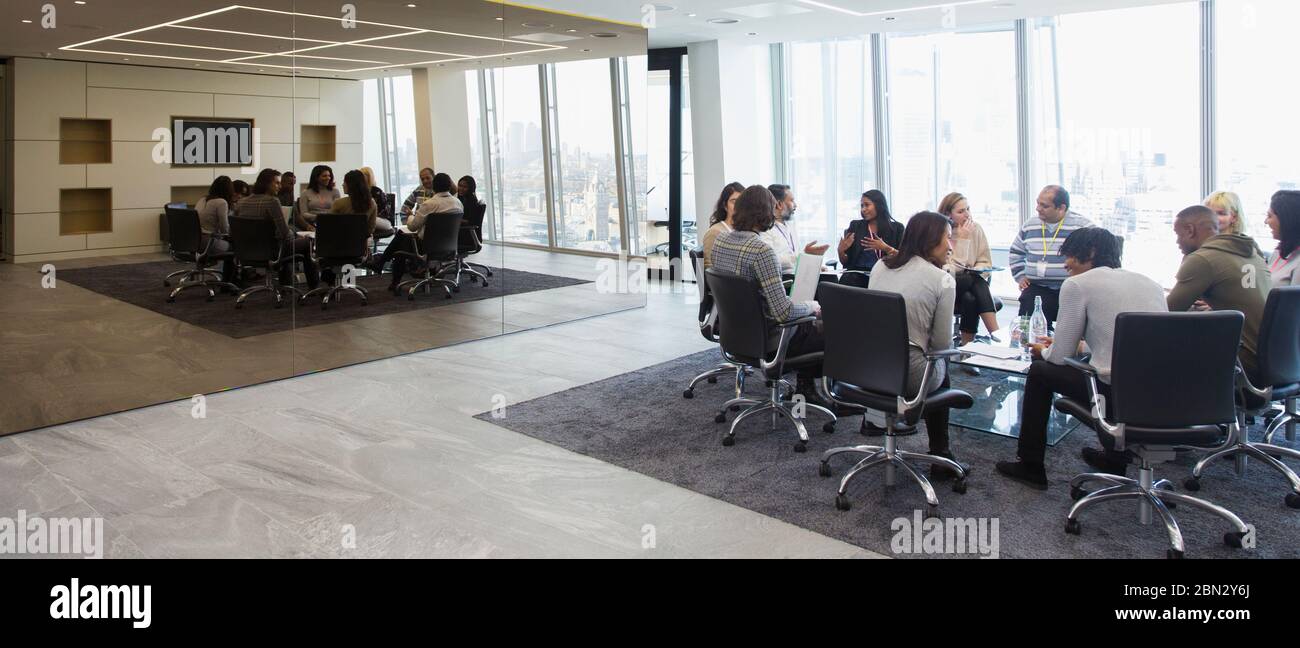 Business people in circle in conference room meeting Stock Photo - Alamy