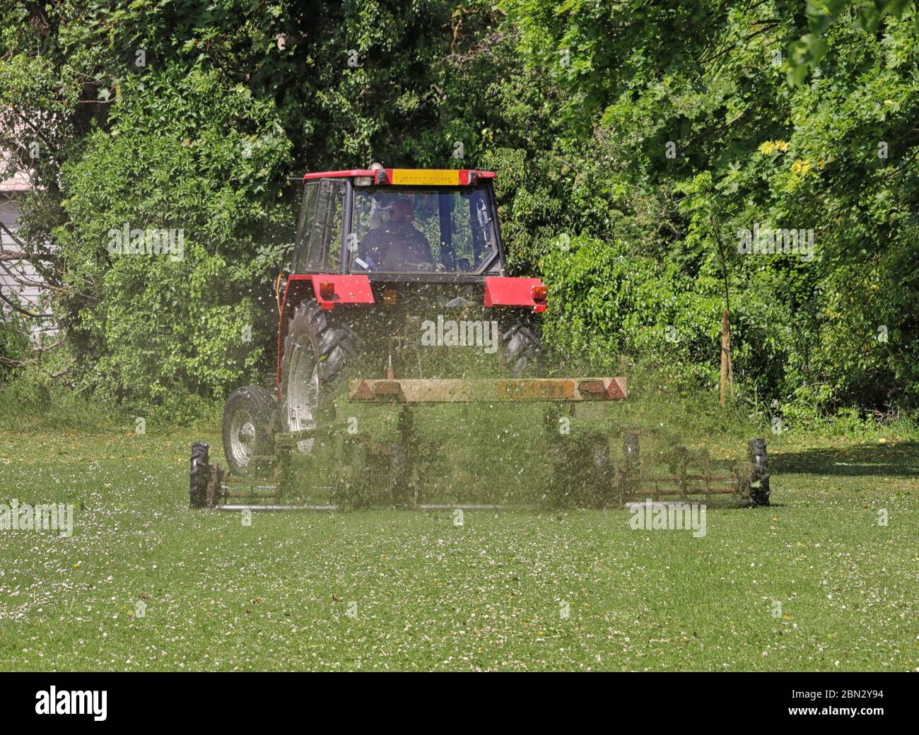 Tractor with trailer Mowing grass in a Public Park in England Stock ...
