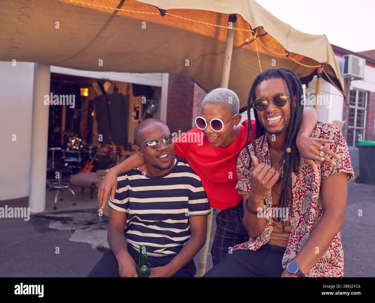 Happy musicians outside recording studio Stock Photo - Alamy